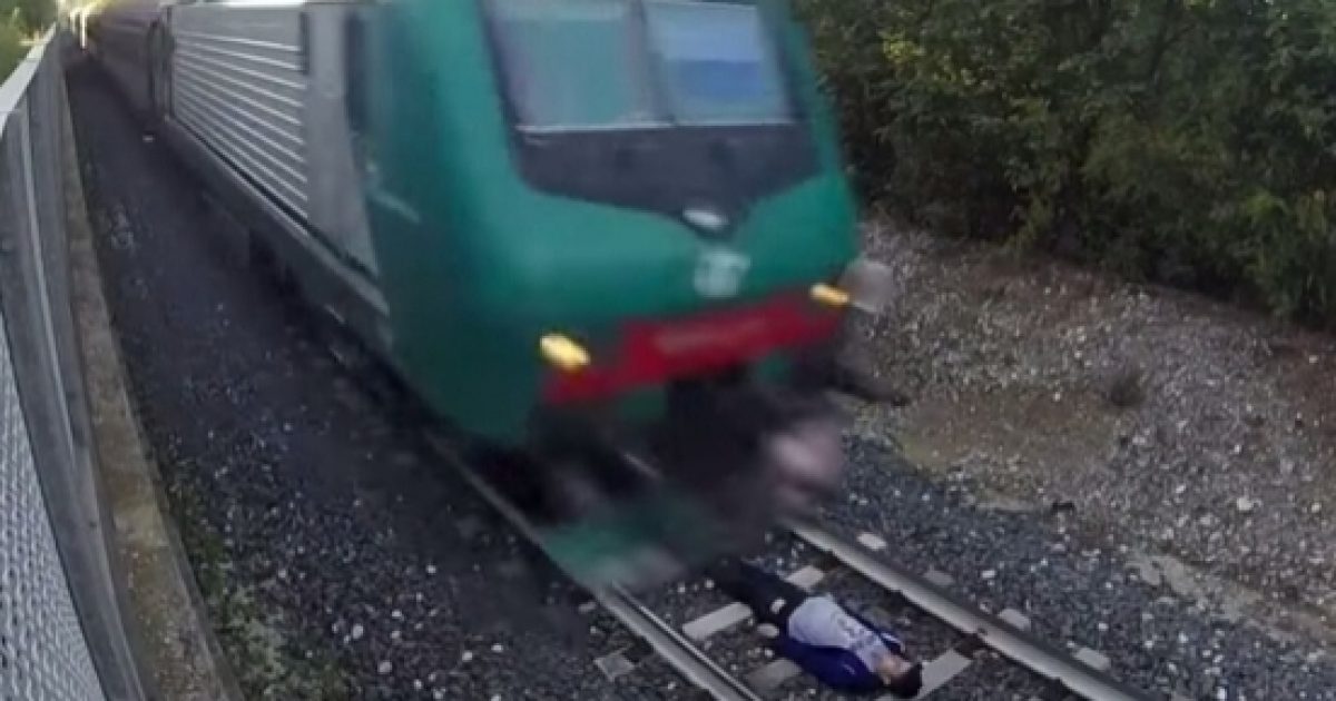 Kids lay down on tracks so train passes over them - warning on deadly ...