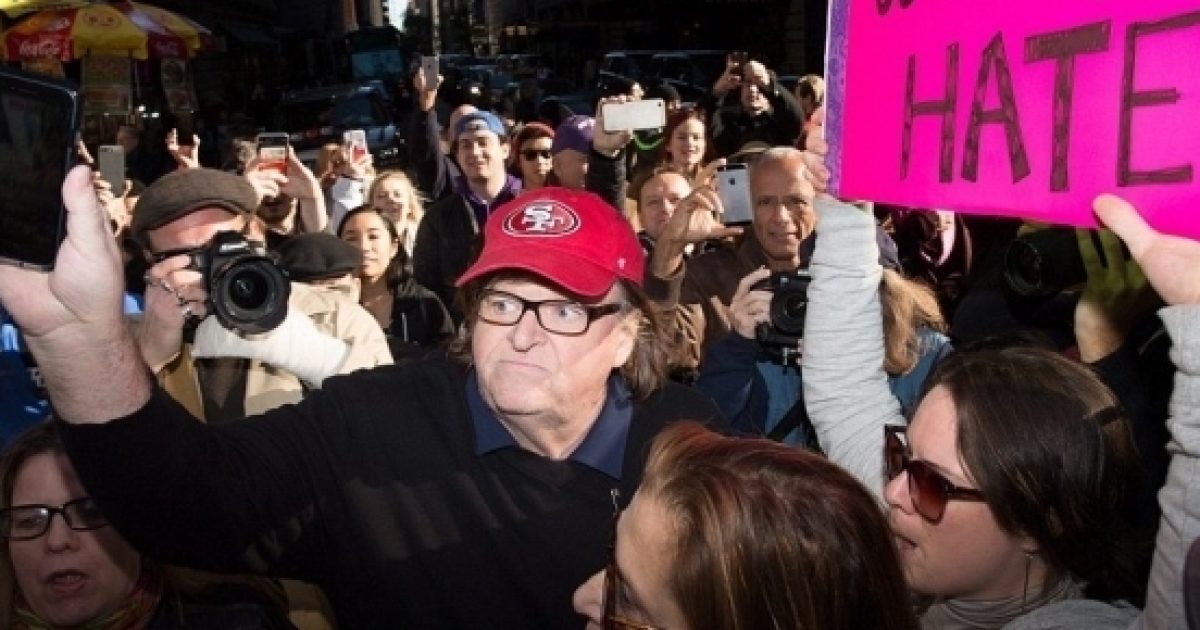 Michael Moore live streams Muslim ban protest at JFK, 'shut this place ...