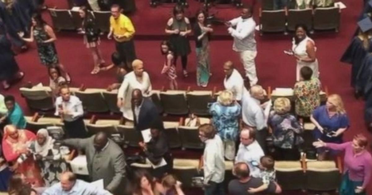 Parents fight in a church during a high school graduation