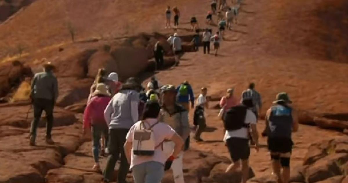 Australia: Tourists flock to the sacred site of Uluru before ban on ...